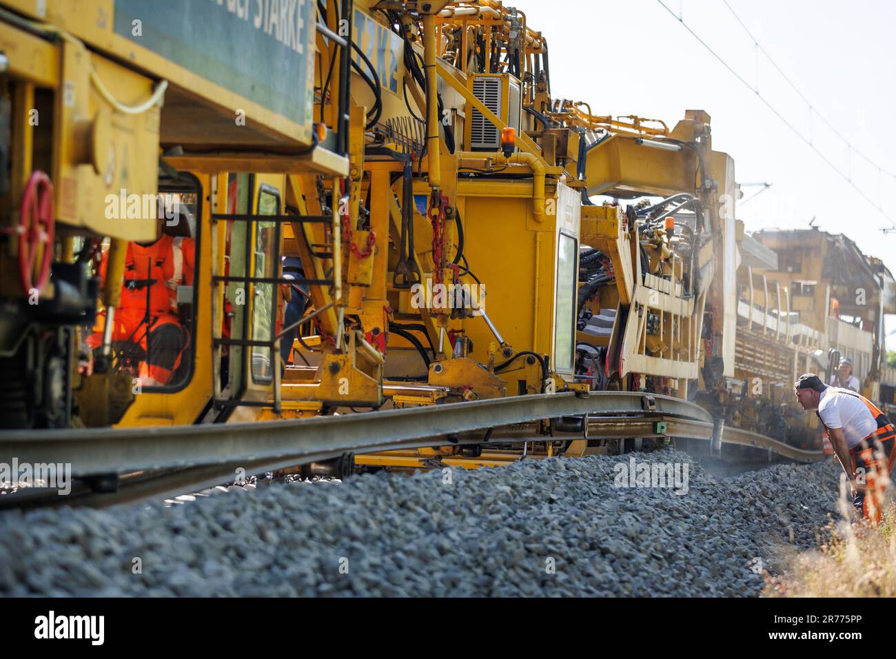 13 June 2023, Bavaria, Markt Bibart: A track renewal train is being ...