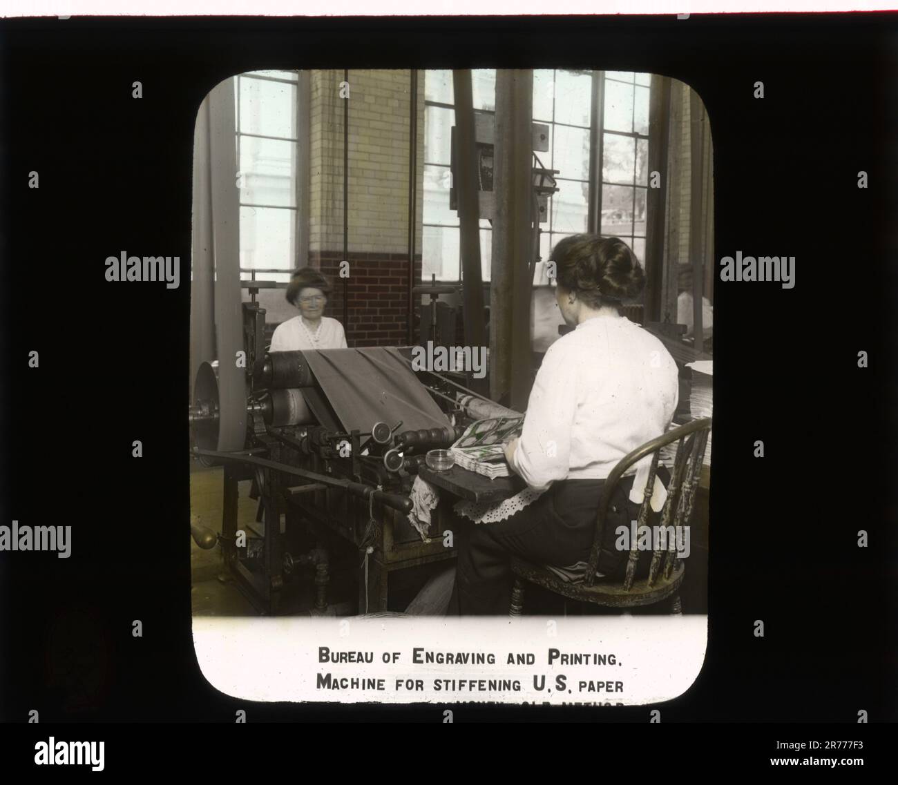 Photograph of Female Employees Operating Machines for Stiffening Paper ...