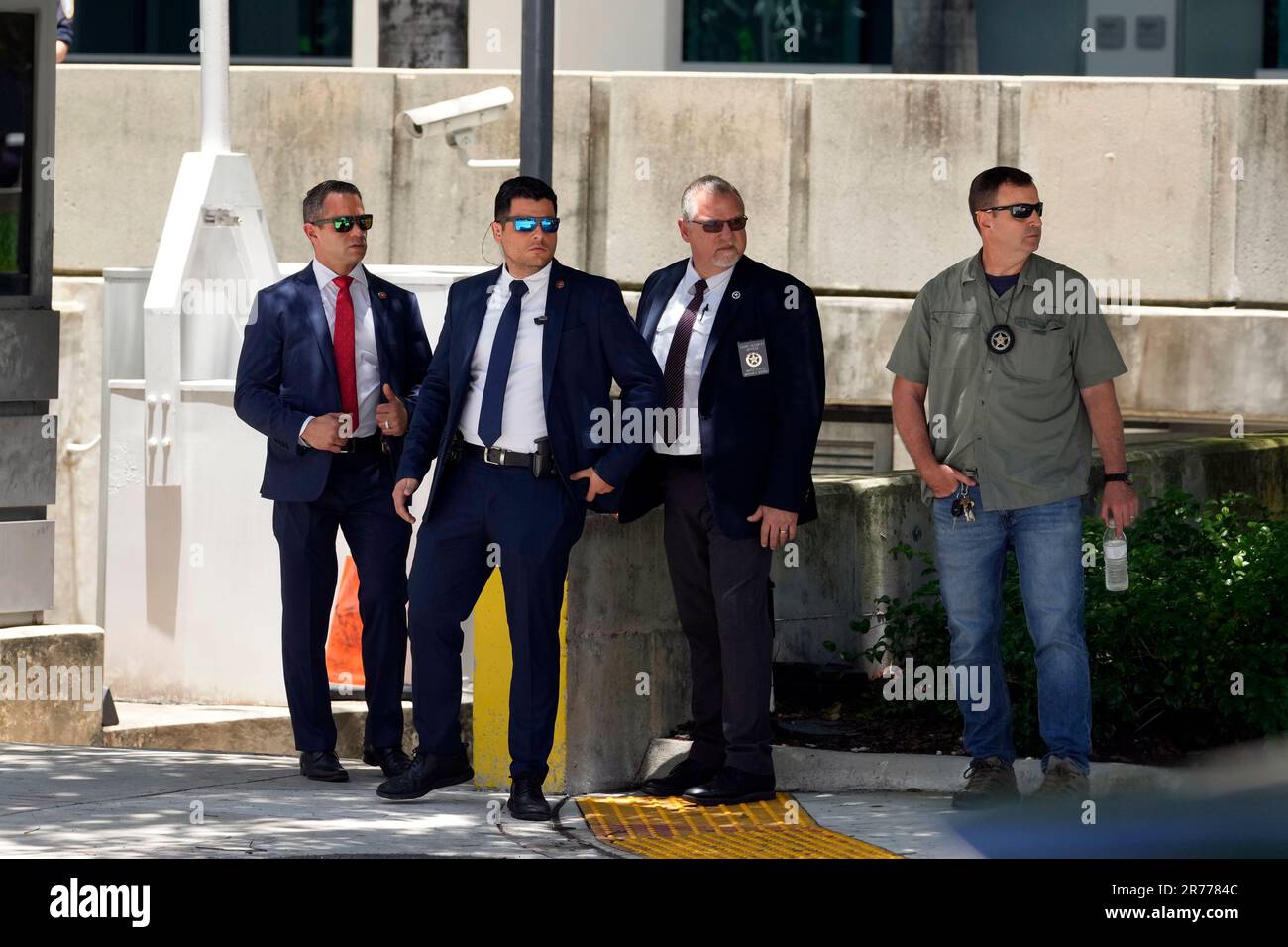 U.S. Secret Service agents, court security and a U.S. Marshal wait near ...