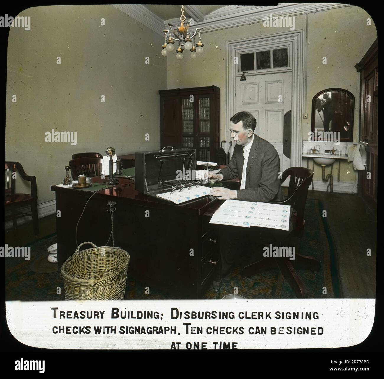 Trasury Building: Disbursing Clerk signing checks with signagraph. Ten ...