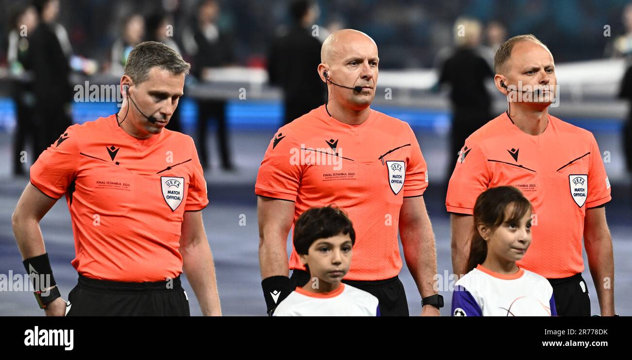 ISTANBUL, TURKEY - JUNE 10: referee Szymon Marciniak and Pawel ...
