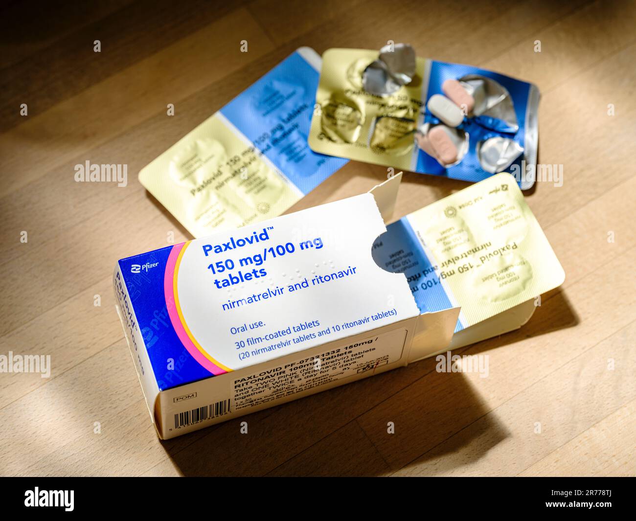 An open packet Plaxovid antiviral tablets by Pfizer - used in the ...