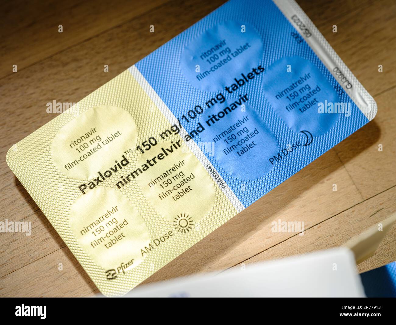 An open packet Plaxovid antiviral tablets by Pfizer - used in the ...