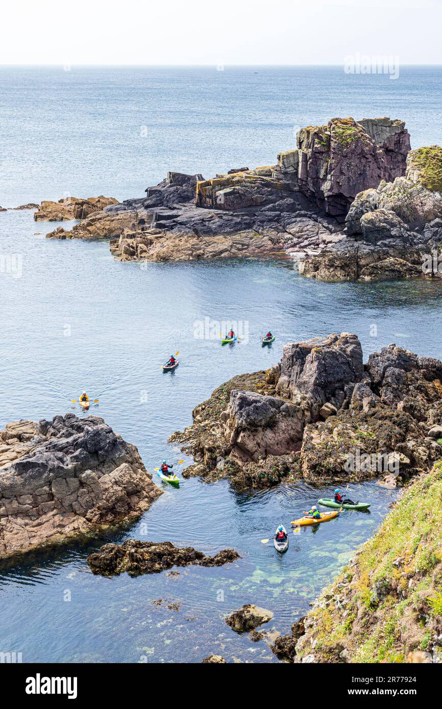 Canoeists taking a rest at St Non's Bay on the St David's peninsula in ...