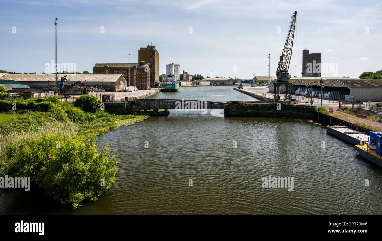 Warehouses and silos rise from the quayside of Sharpness Dock in ...