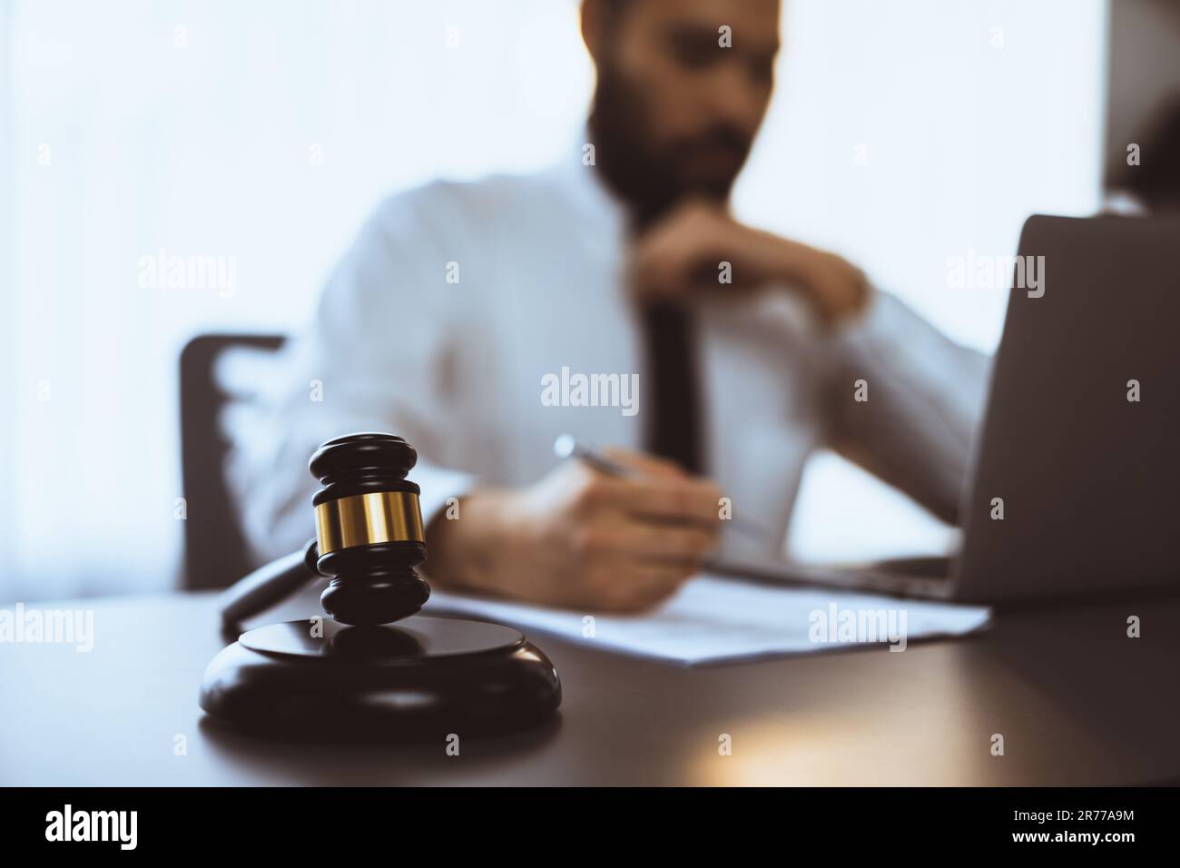 Focus wooden gavel hammer on blur background of lawyer working with ...
