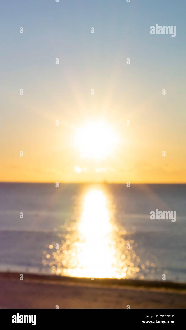 Blurred background. Sun shining in blue sky during sunset dawn. Sunrise ...