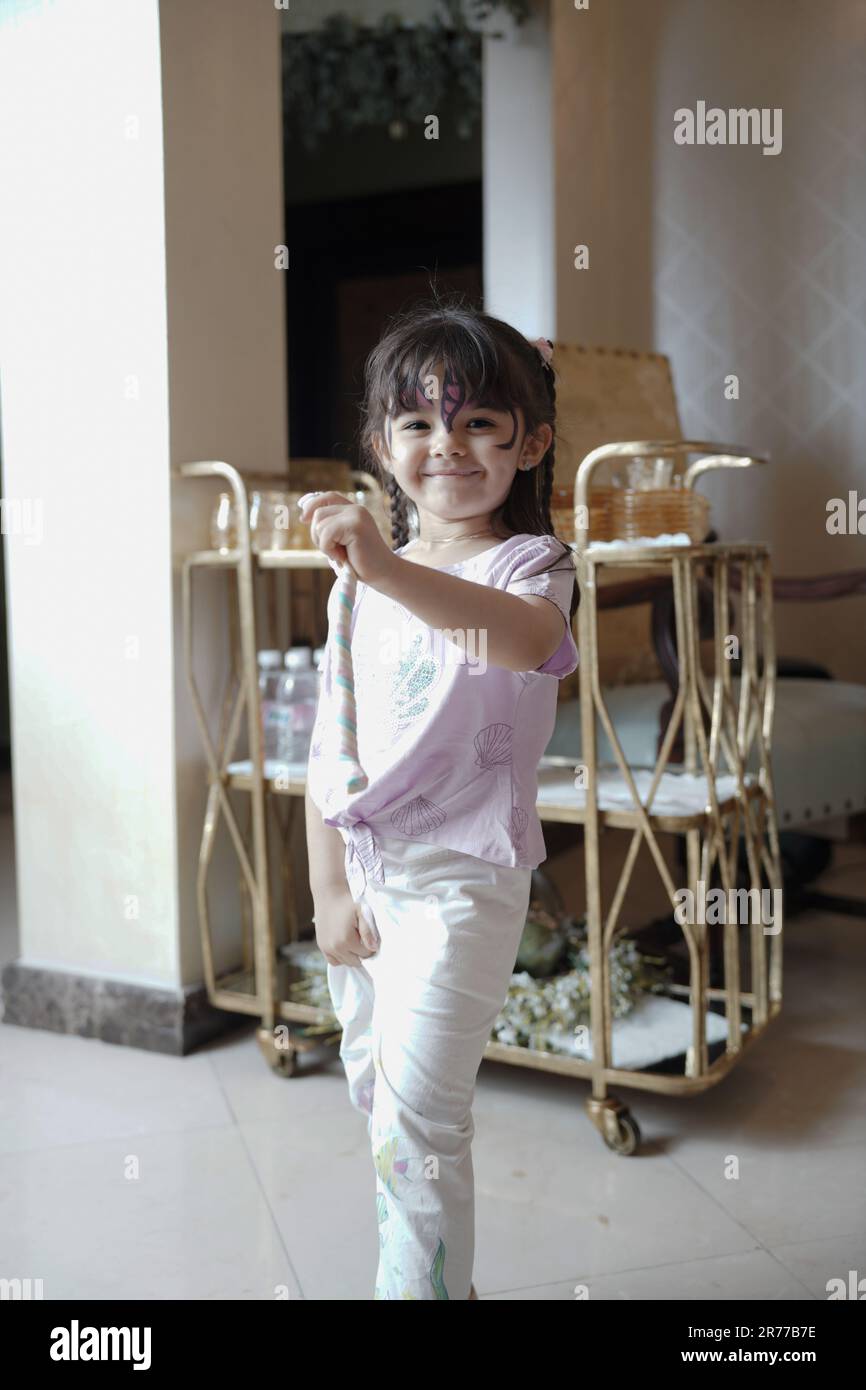 Naughty kid reaction or facial expression. Naughty little girl eating ...