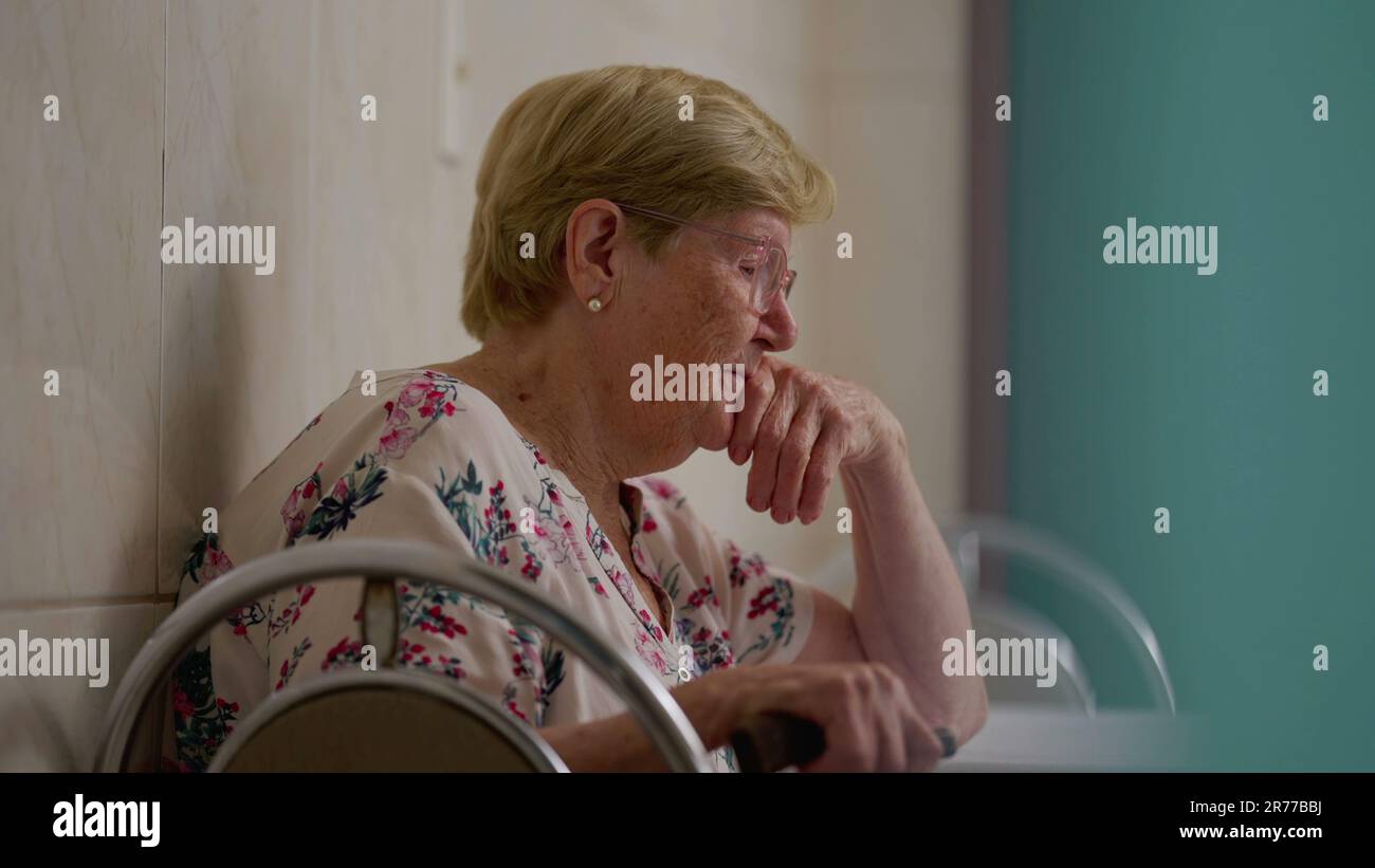 Contemplative senior woman at home, pensive elderly person in 80s with ...