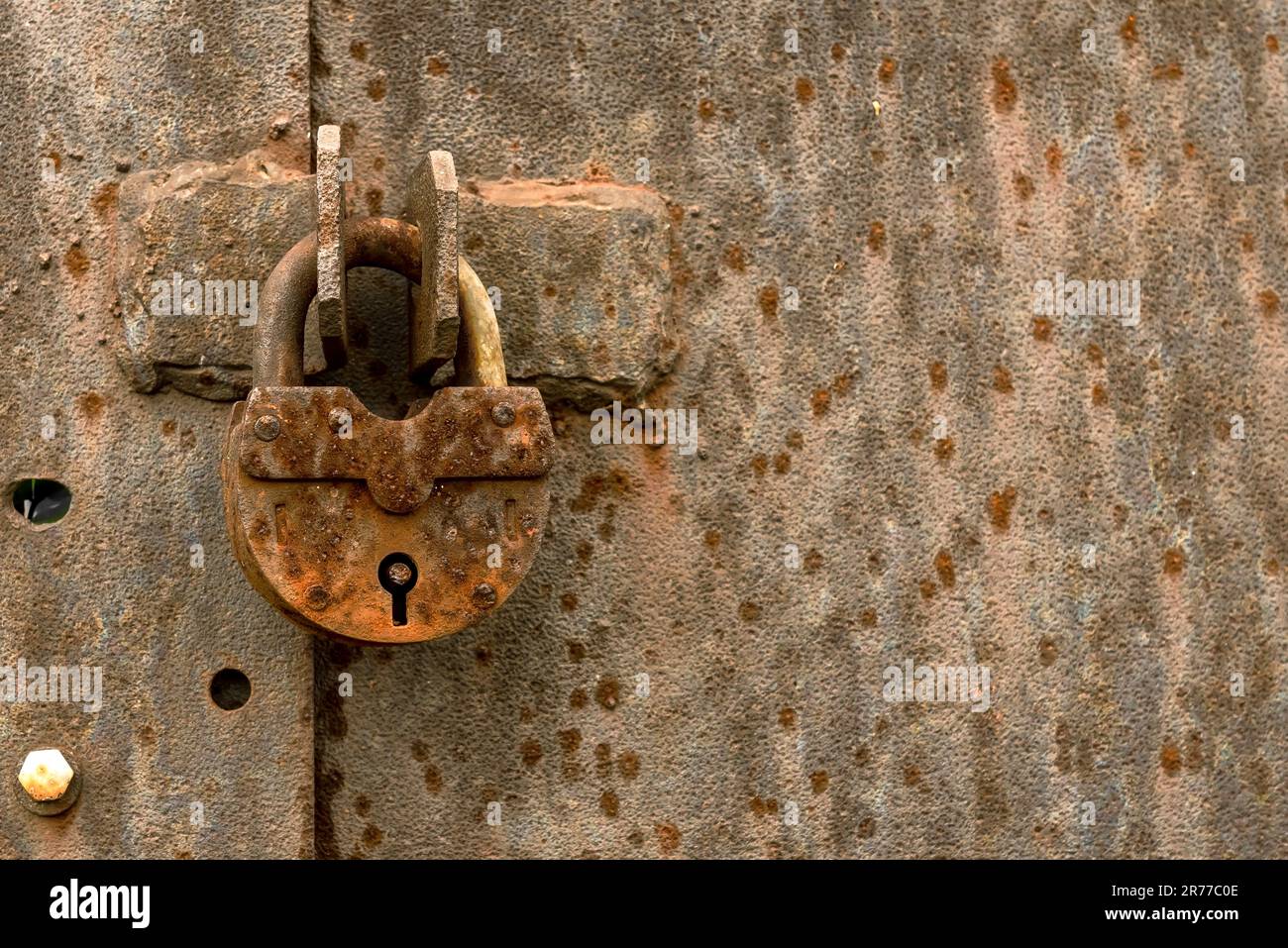 Old rusty lock on metal doors. Lock on the door with an empty place for ...