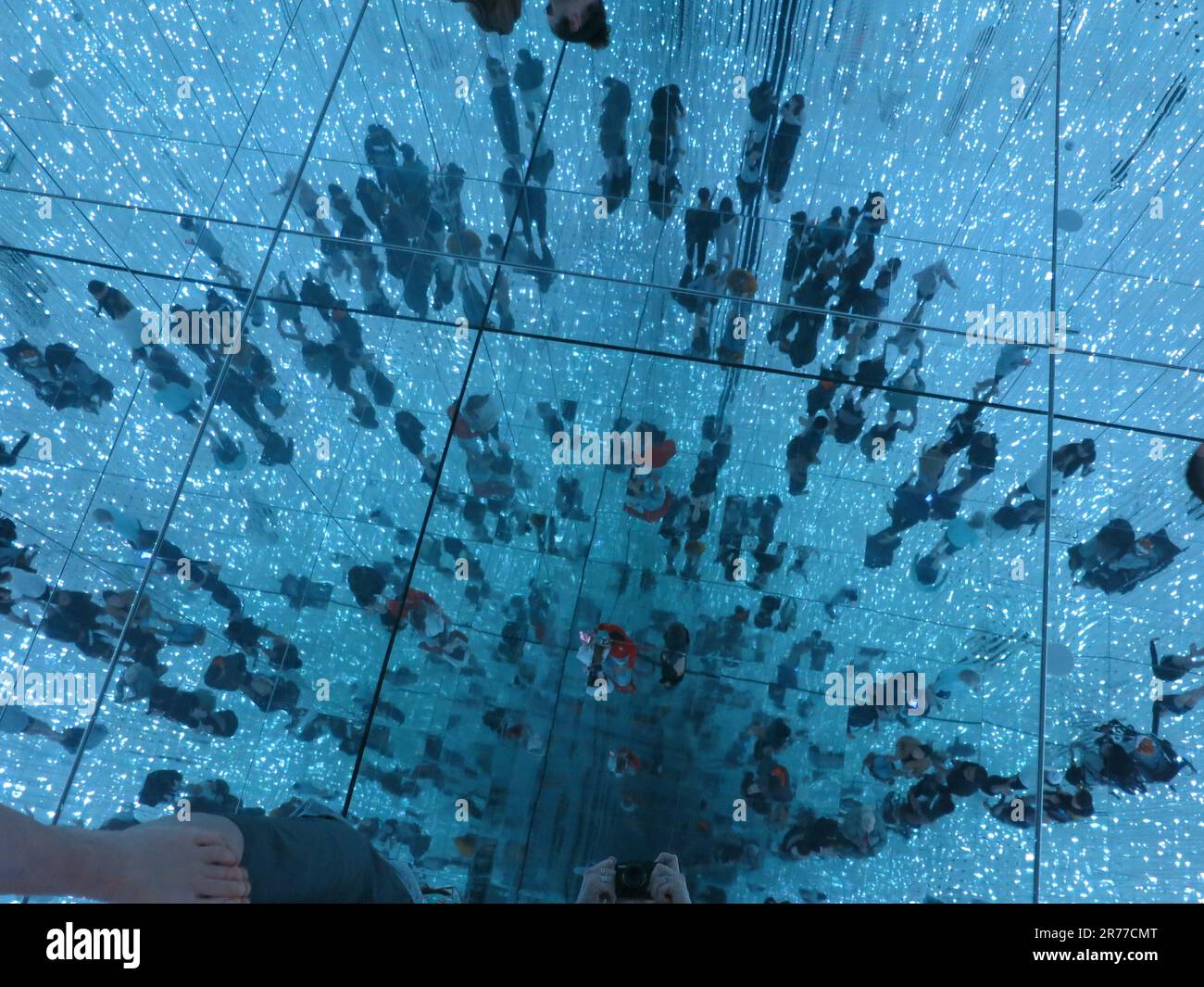 teamLab Planets, Tokyo: a room full of strings of LED lights, mirrored ...