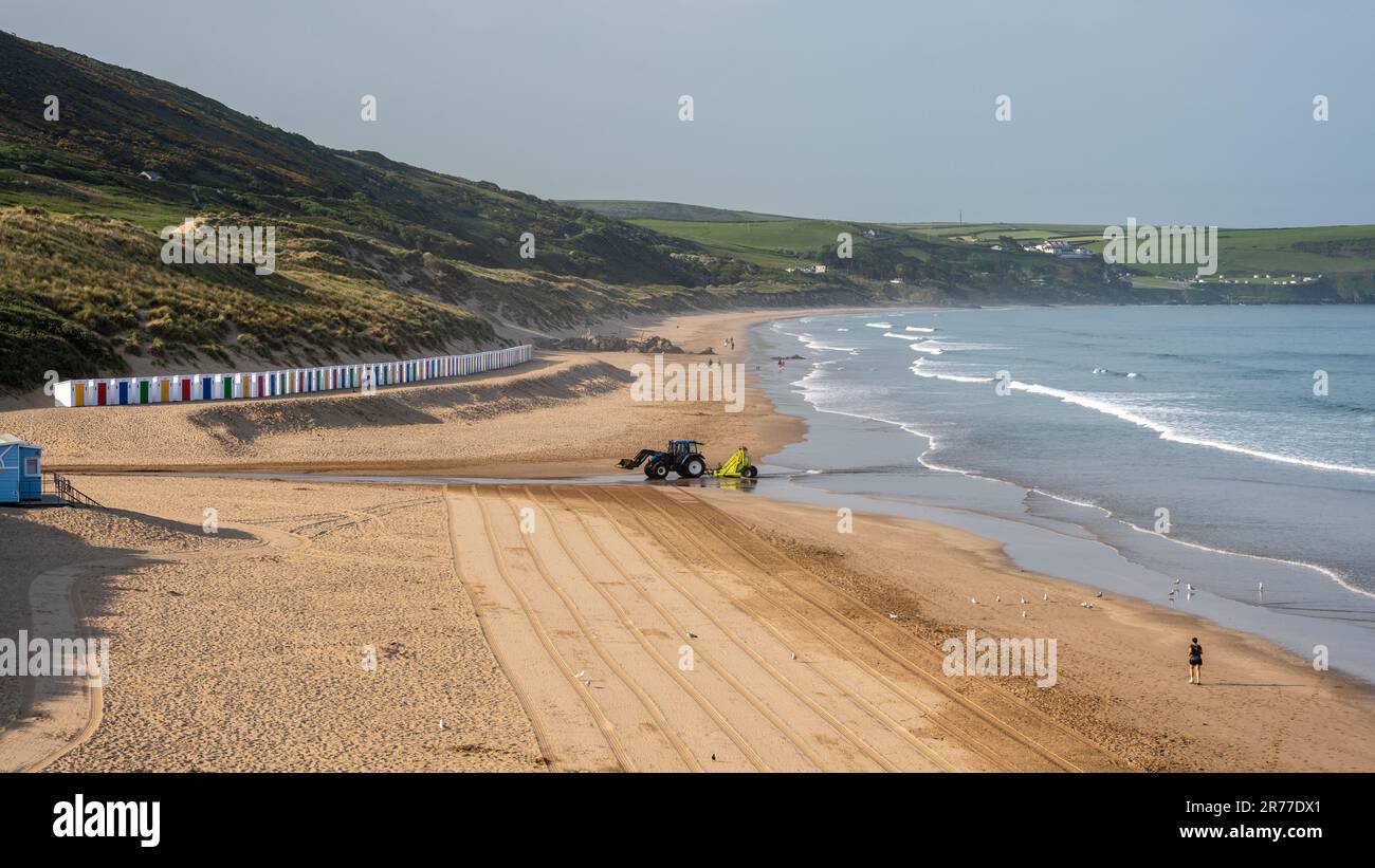 Morning sun shines on the beach and sand dunes at Woolacombe in North ...