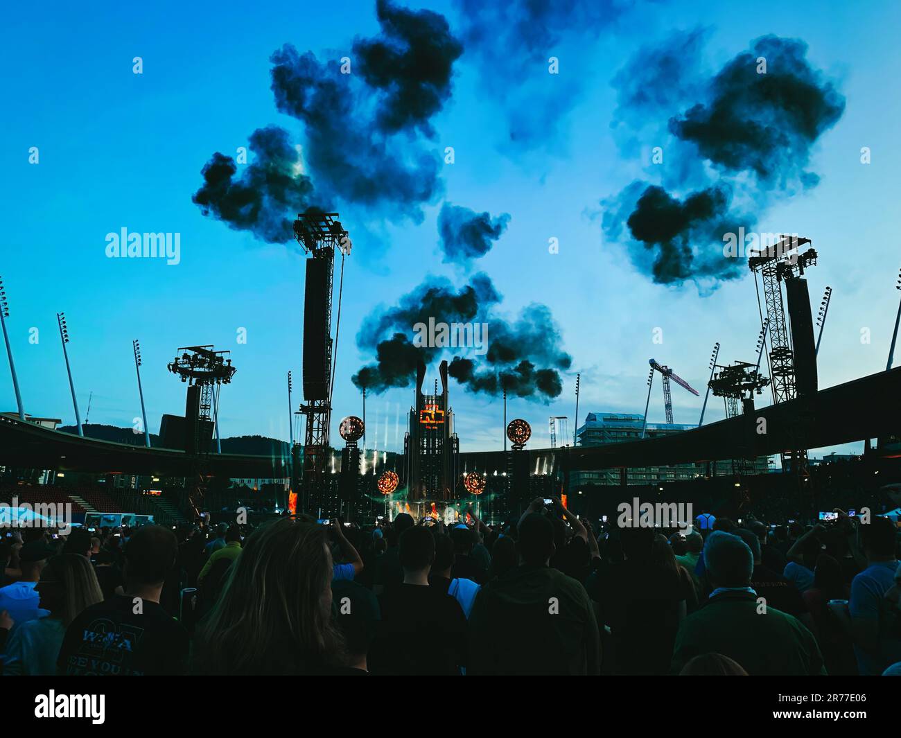 A large crowd of people dancing along to a heavy metal music concert in ...