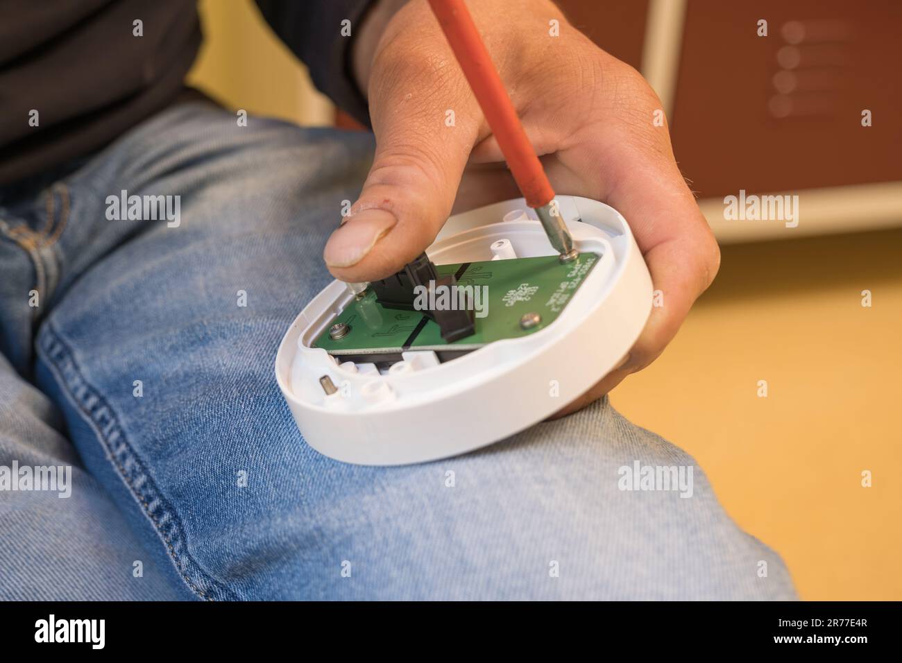 Installation of smoke on the ceiling. smoke detector in disassembled ...
