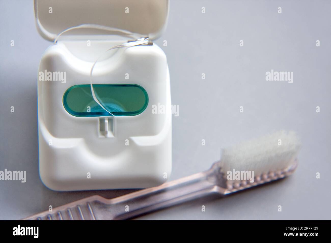 Dental floss with toothbrush Stock Photo - Alamy