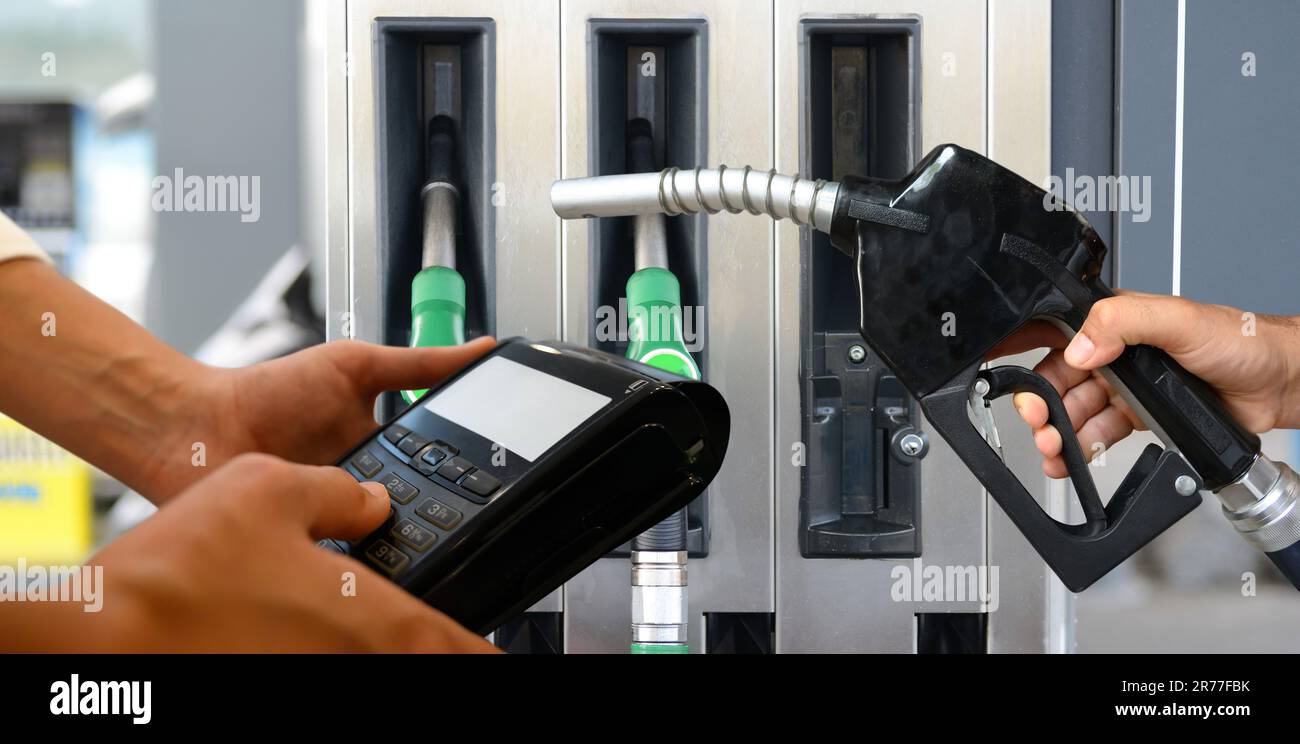 Bank pos ready to pay for a car fuel refueling Stock Photo - Alamy