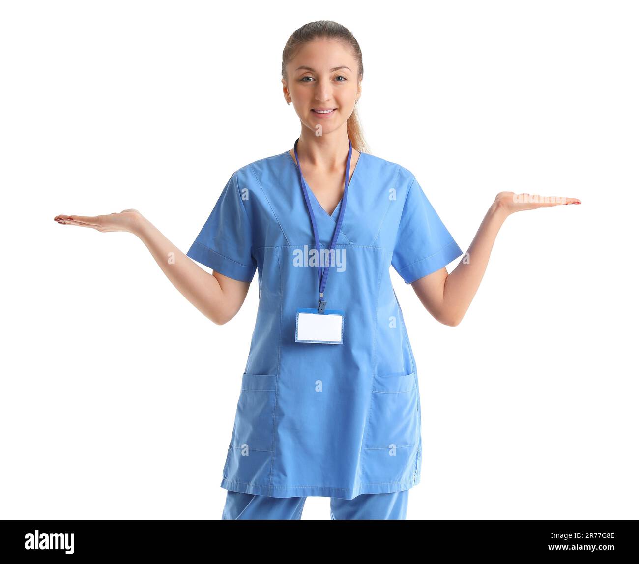 Female medical intern with badge showing something on white background ...