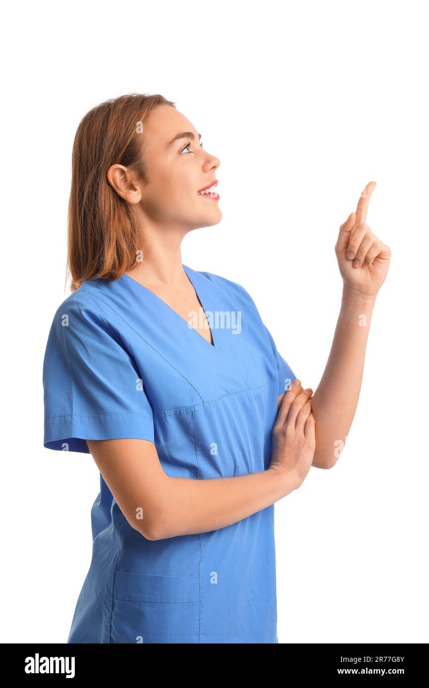 Female intern pointing at something on white background Stock Photo - Alamy