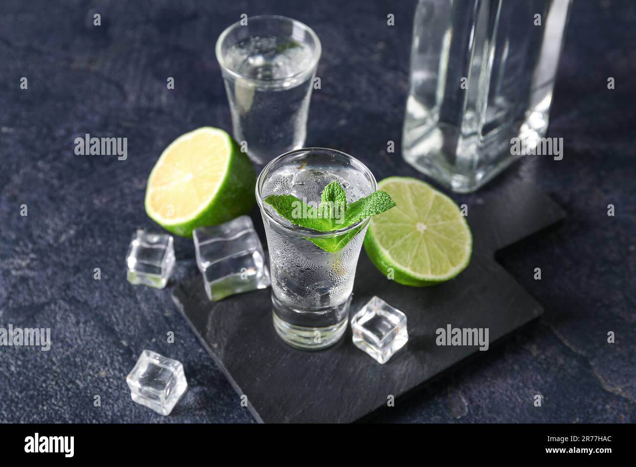 Glasses of cold vodka on black background Stock Photo - Alamy