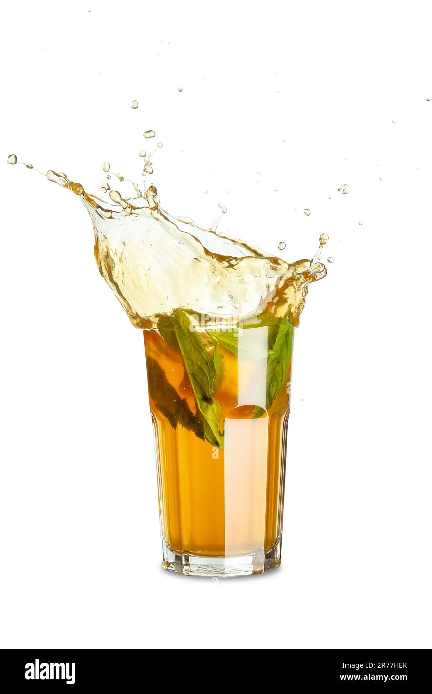 Glass of ice tea with splashes on white background Stock Photo - Alamy