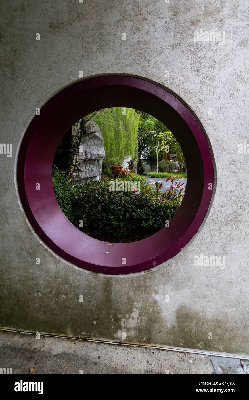 Wall wit the round hole. Window. Gardens by the bay, Singapore Stock ...