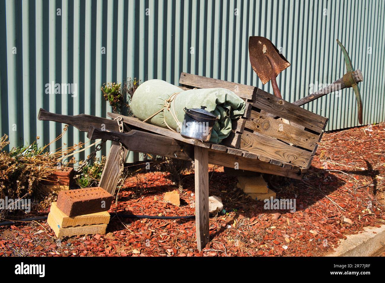 Some tools of a traditional 19th-century gold digger: wheelbarrow ...