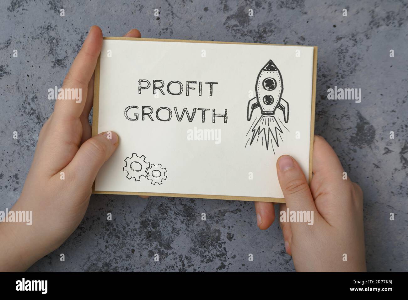 The phrase on the white envelope in the hands of Profit Growth Stock ...