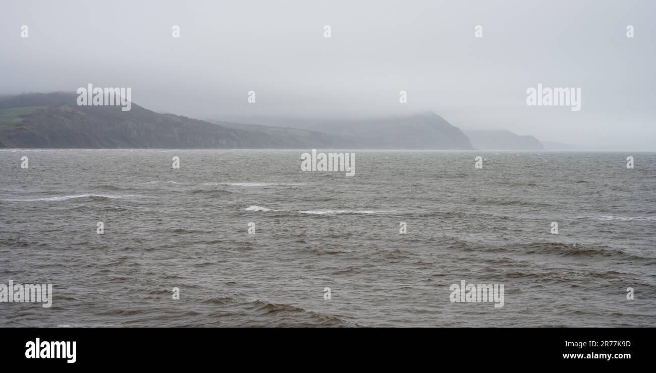 Rain blows off the English Channel over Stonebarrow Hill, Golden Cap ...