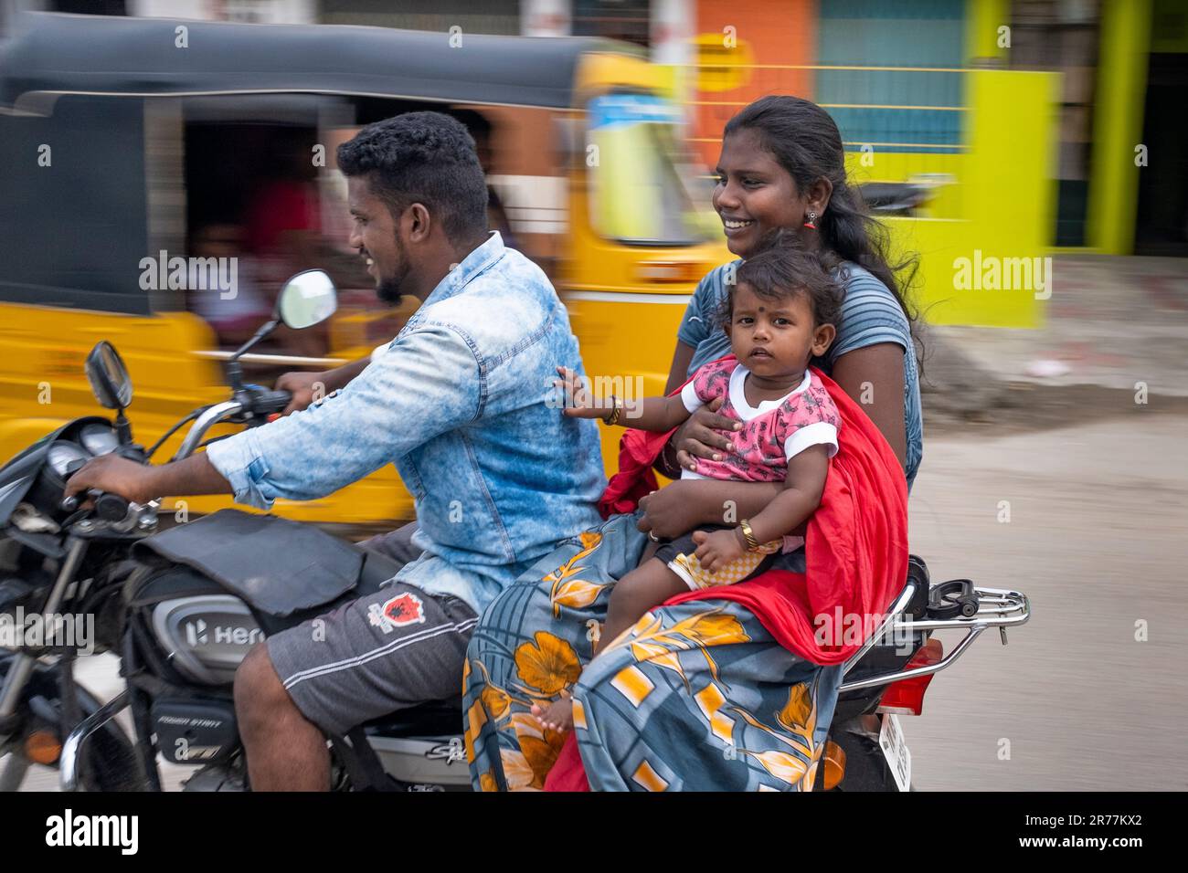 Mother, father, and baby on scooter, Mahabalipuram, Tamil Nadu, India ...