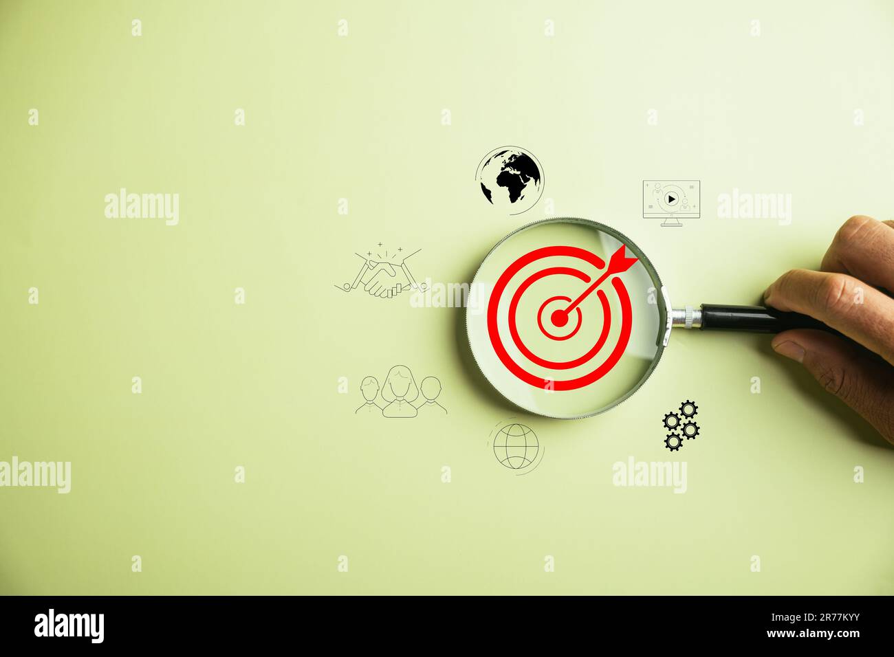 Target icon under magnifying glass Stock Photo - Alamy