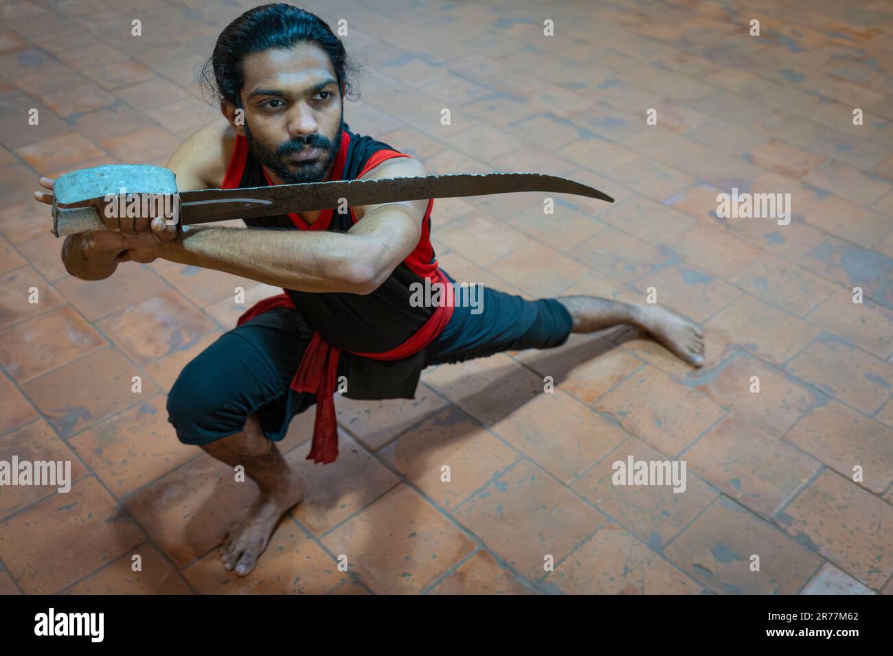 Performer demonstrates traditional Indian martial arts at the ...