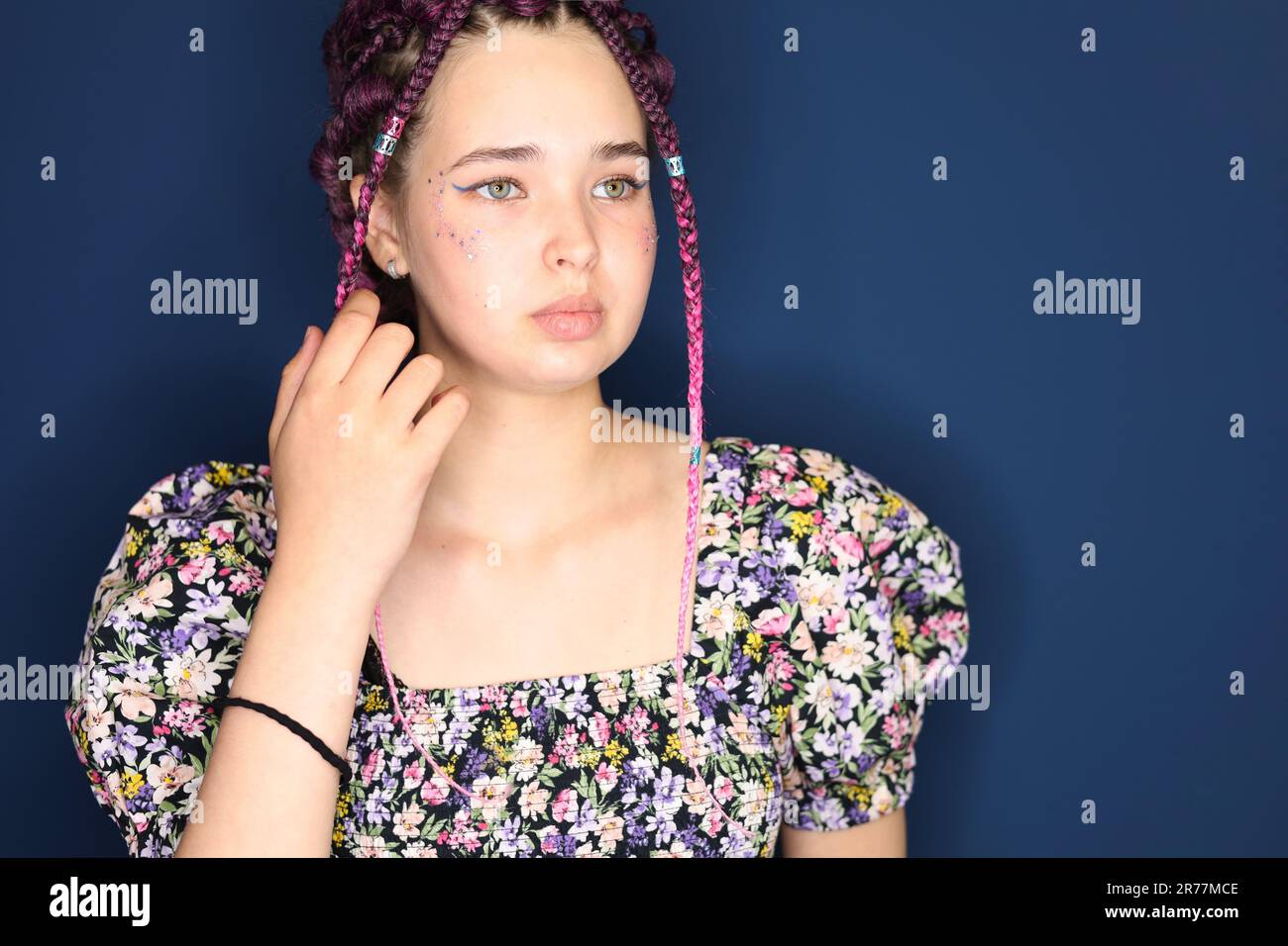 girl with brown hair and pigtails braided with artificial hair braiding ...