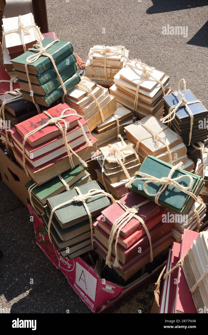 Bundles of old books tied up with string Stock Photo - Alamy