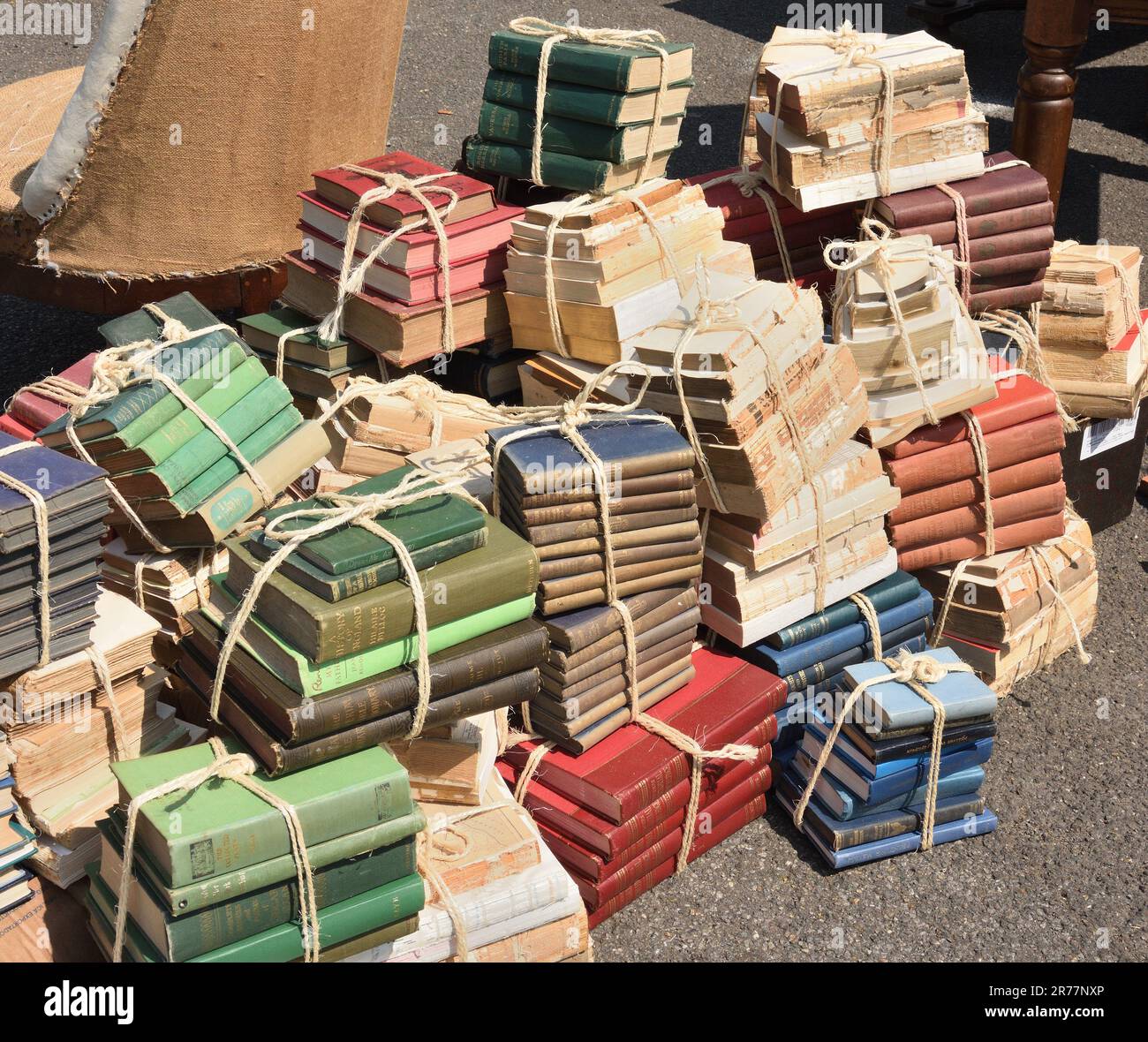 Bundles of old books tied up with string Stock Photo - Alamy