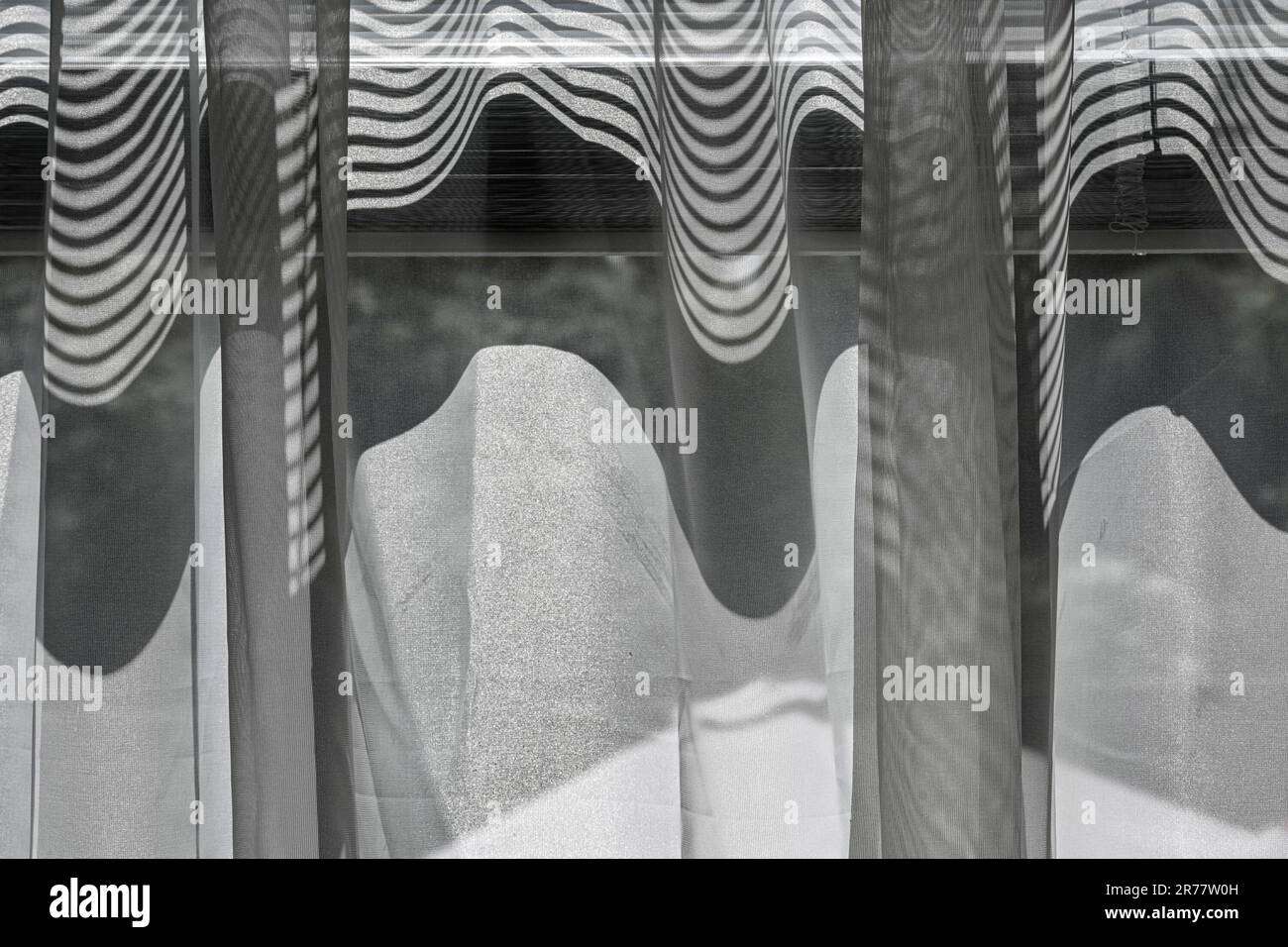 Abstract pattern formed by window shades and sheer curtain Stock Photo ...