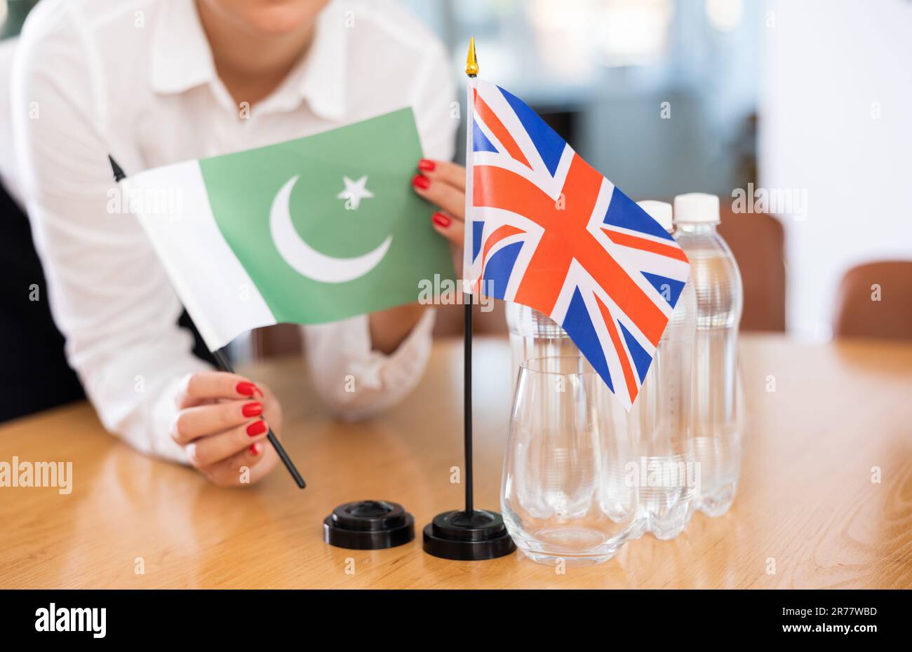 National flag of Pakistan and United Kingdom on meeting table Stock ...