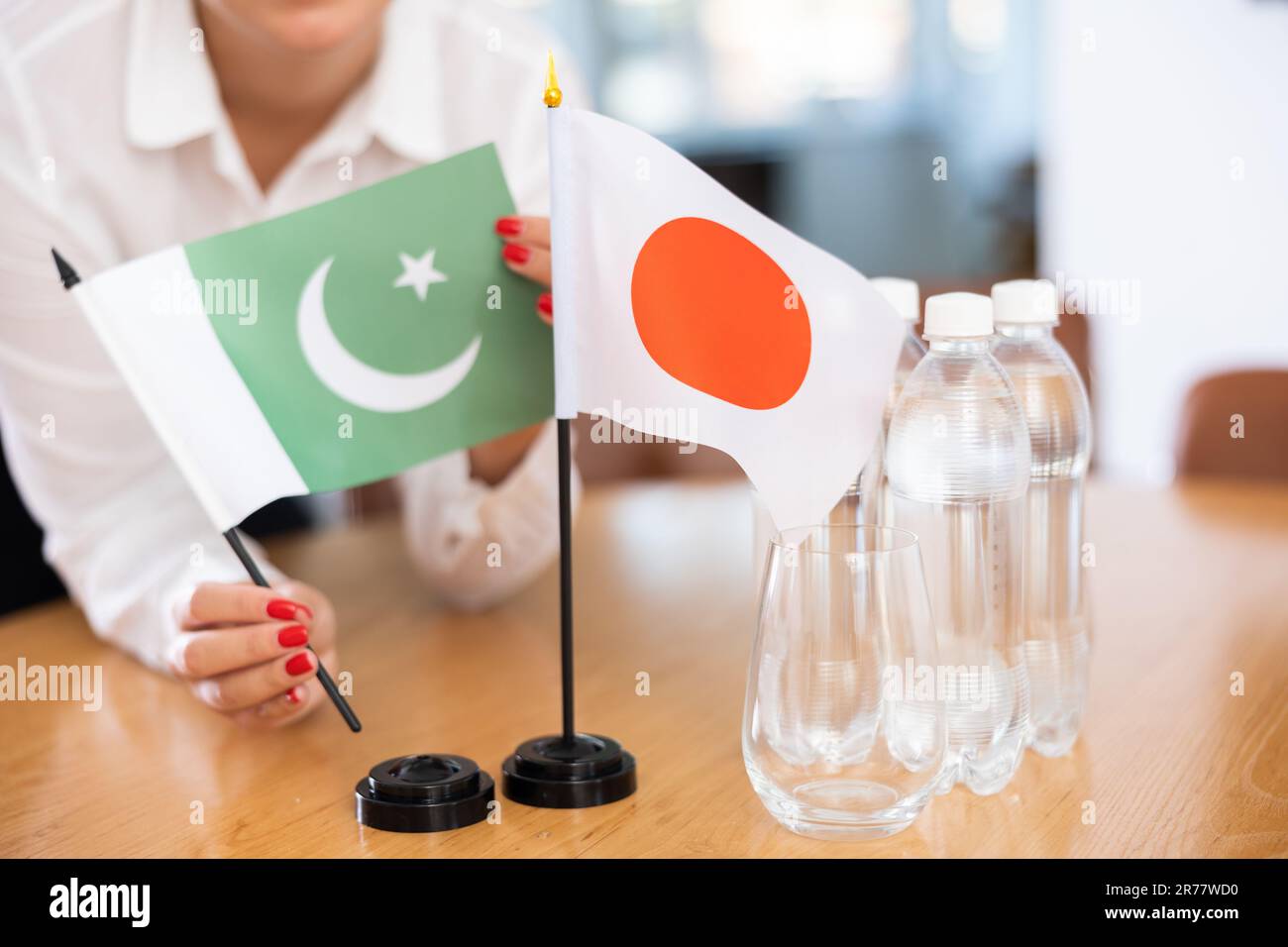 Little flag of Japan on table and flag of Pakistan put next to it by ...