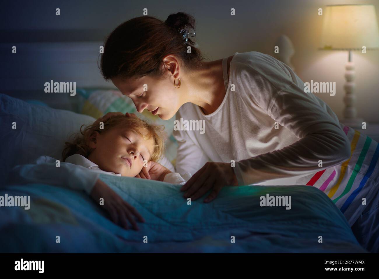 Child sleeping in dark bedroom. Little boy napping. Healthy night rest ...