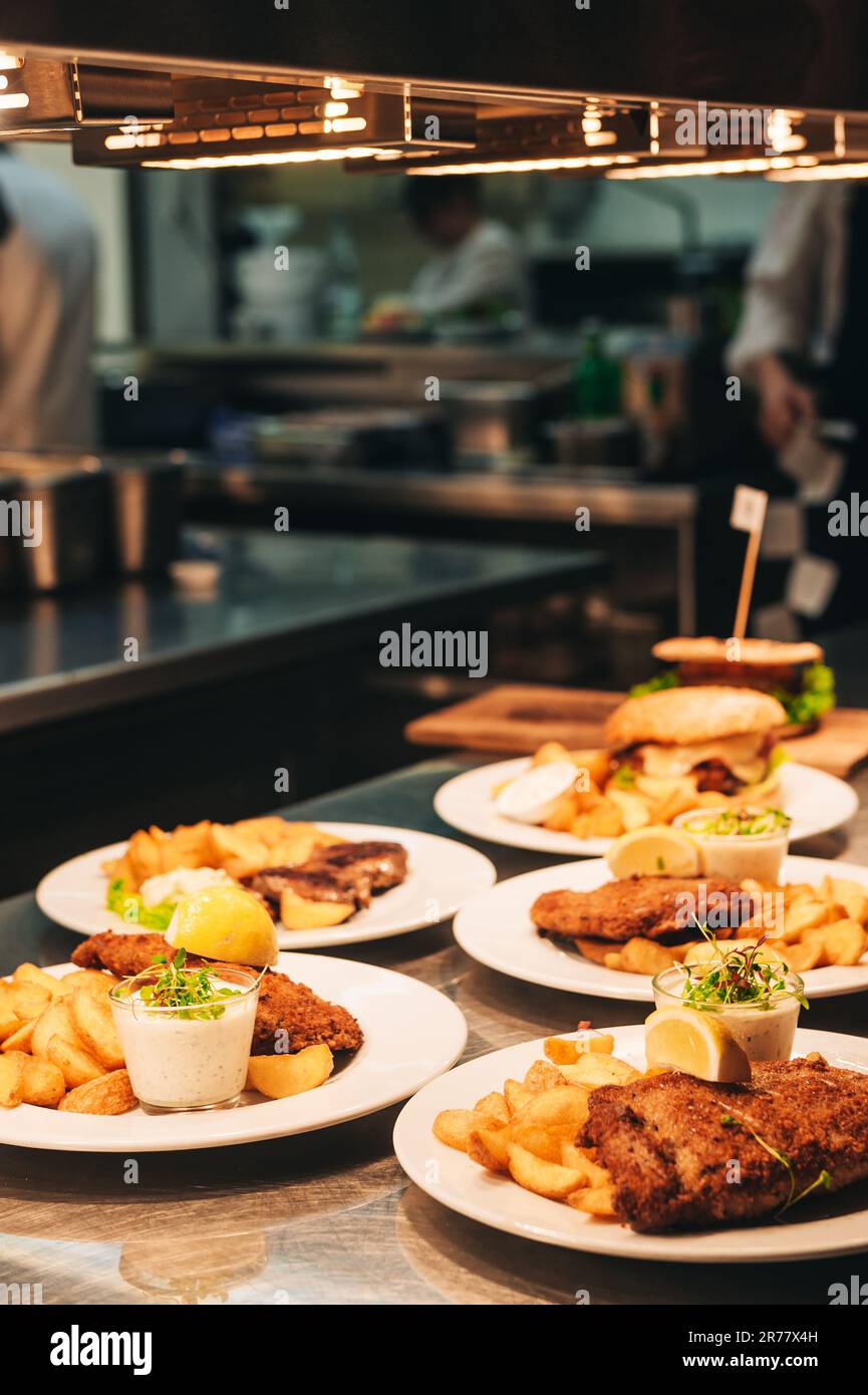 Food orders on the kitchen table in the restaurant Stock Photo - Alamy