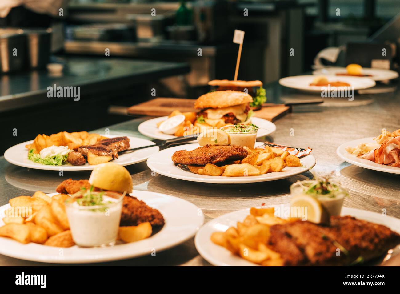 Food orders on the kitchen table in the restaurant Stock Photo - Alamy