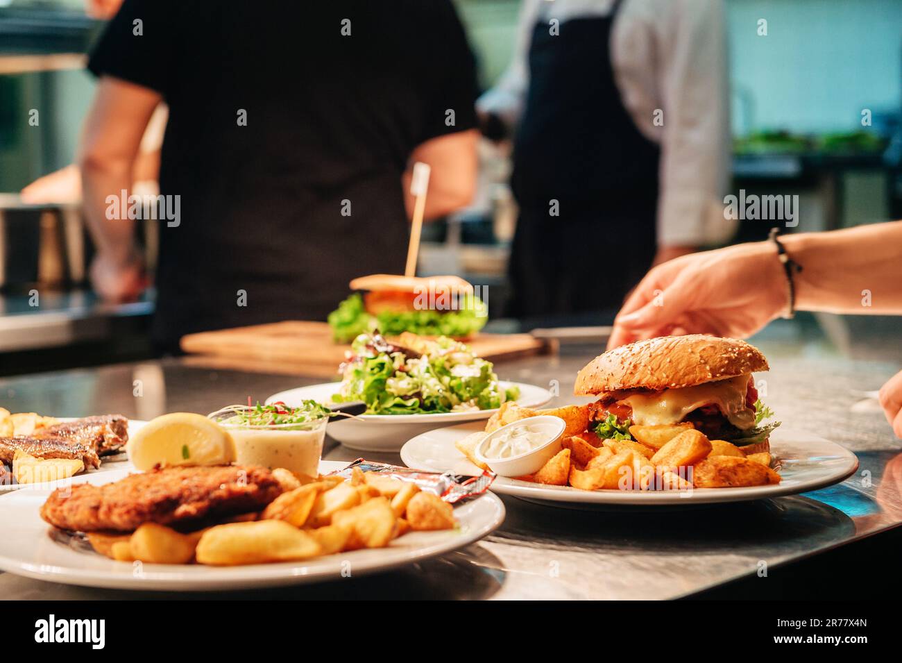 Food orders on the kitchen table in the restaurant Stock Photo - Alamy