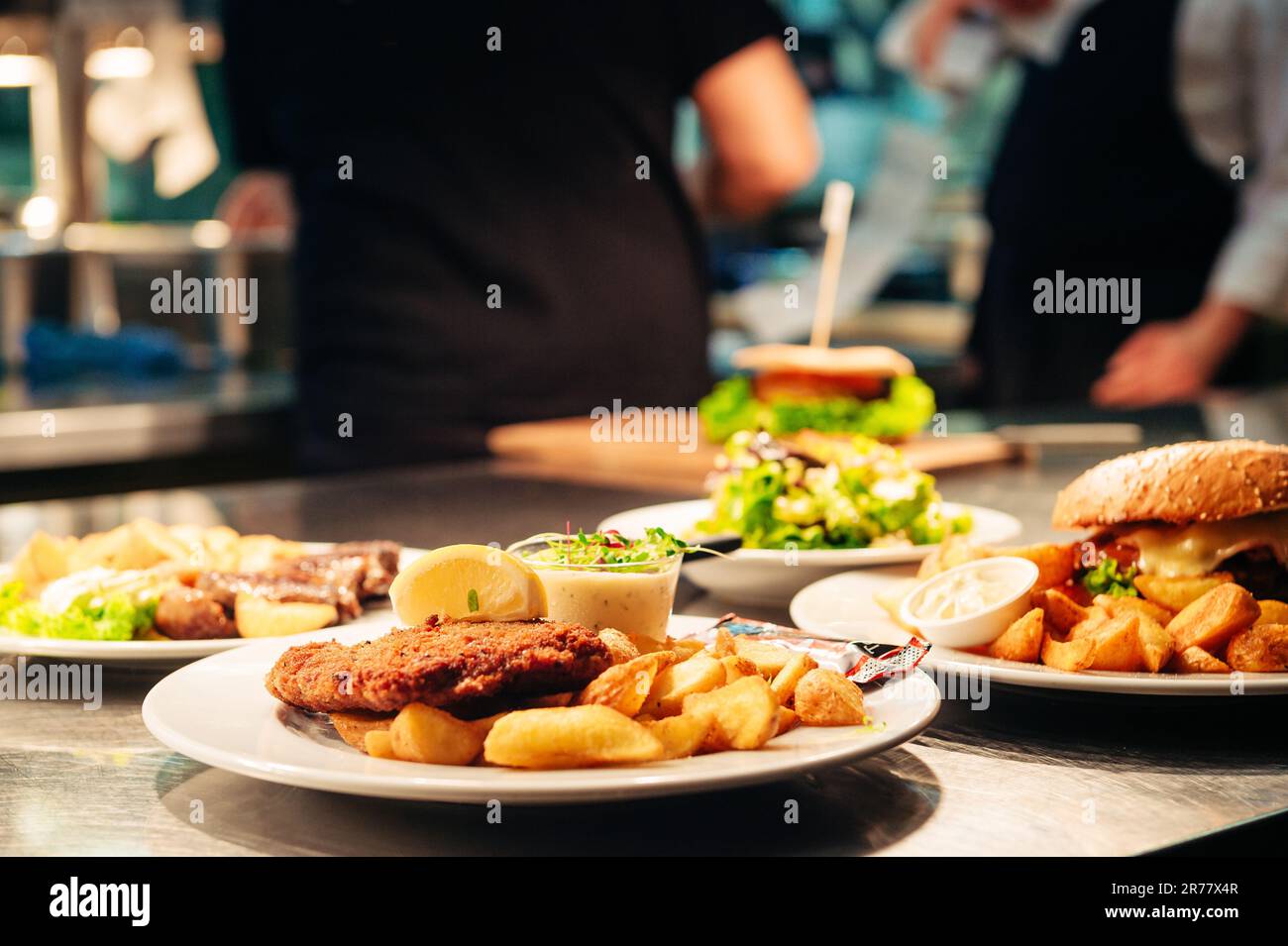 Food orders on the kitchen table in the restaurant Stock Photo - Alamy