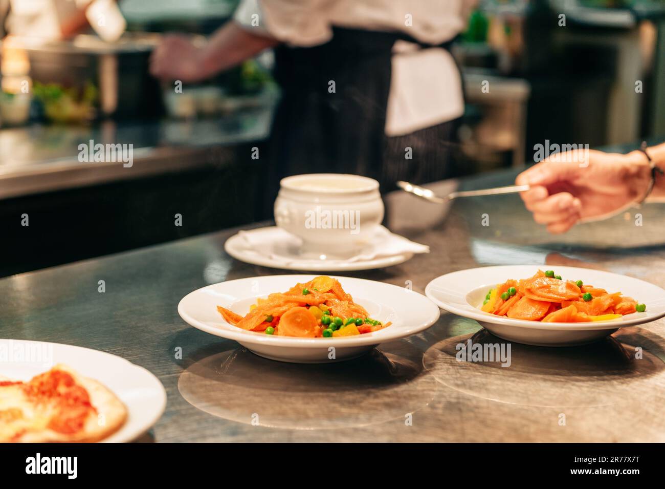 Food orders on the kitchen table in the restaurant Stock Photo - Alamy