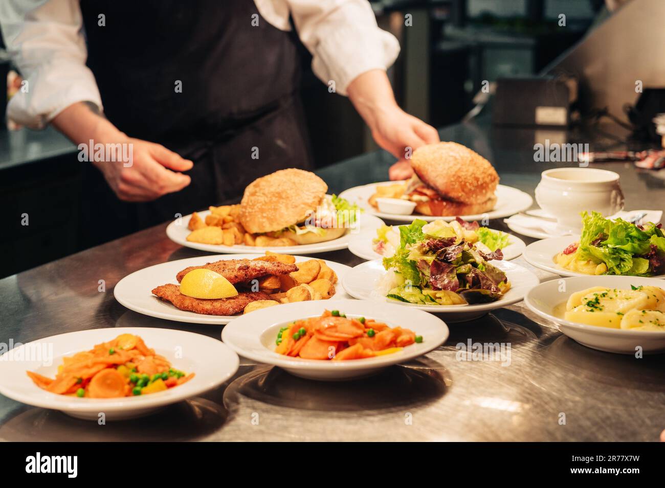 Food orders on the kitchen table in the restaurant Stock Photo - Alamy