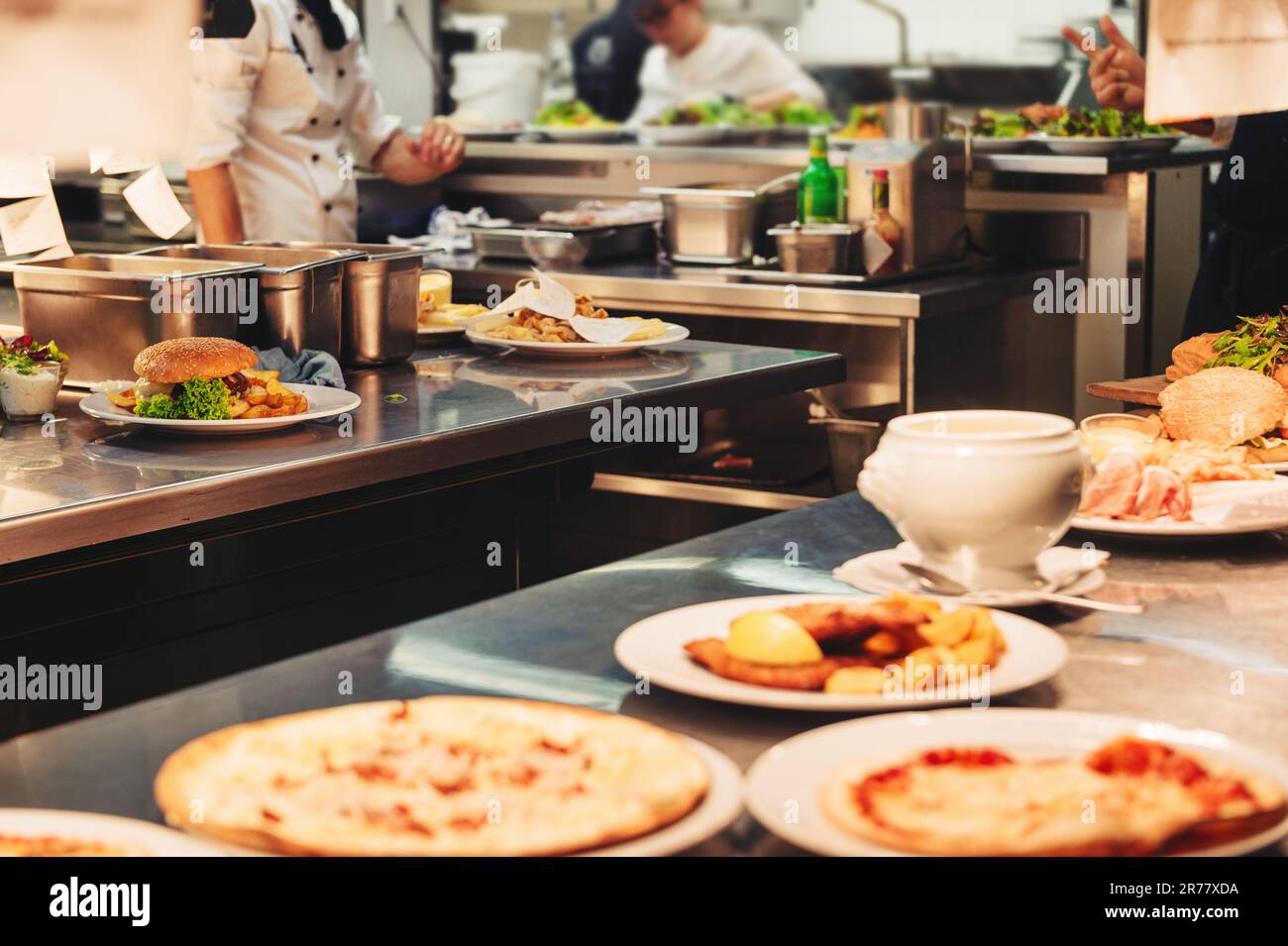 Food orders on the kitchen table in the restaurant Stock Photo - Alamy