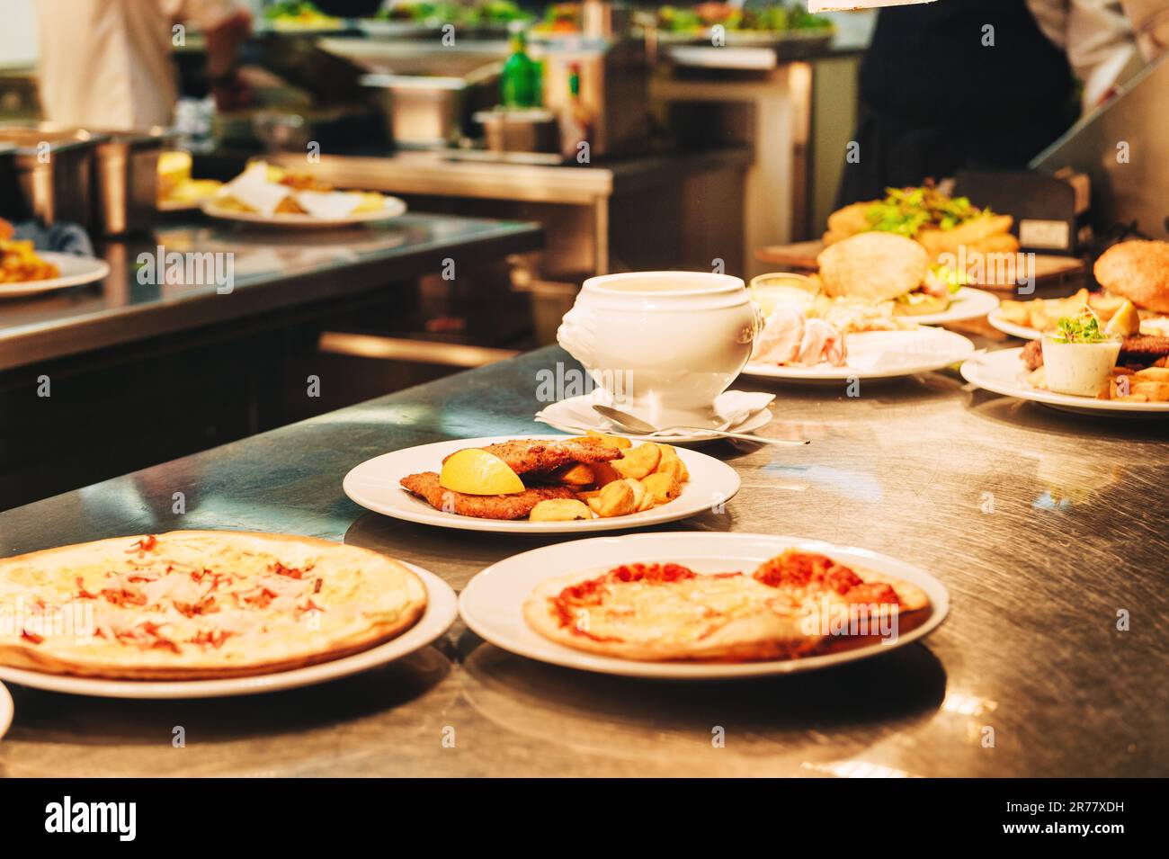Food orders on the kitchen table in the restaurant Stock Photo - Alamy