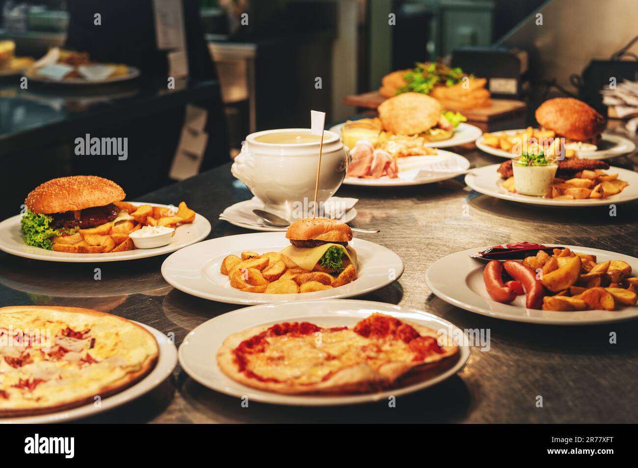 Food orders on the kitchen table in the restaurant Stock Photo - Alamy