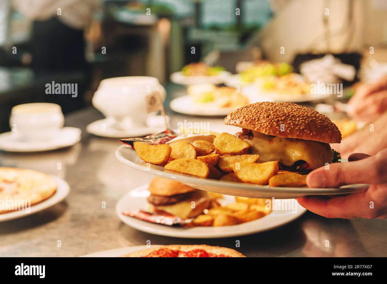 Food orders on the kitchen table in the restaurant Stock Photo - Alamy