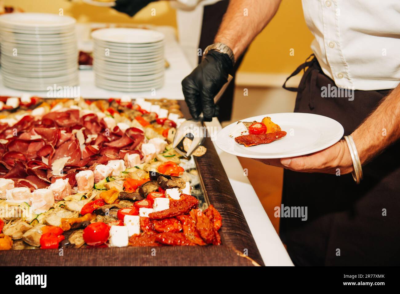 Italian style food catering on wedding or festive party, waiter serving ...