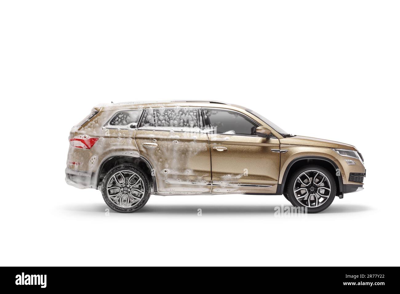 SUV covered in a car wash detergent isolated on white background Stock ...